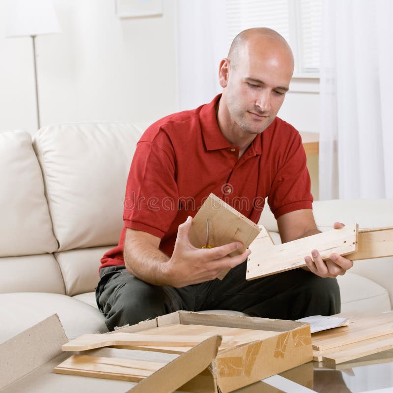 Man Assembling Wooden Shelving Parts Stock Image - Image of person ...