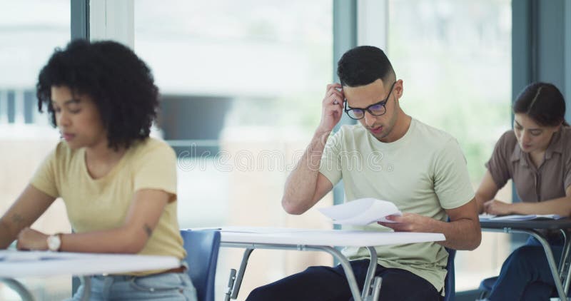 Man, Exam and Confused for Question in Classroom, Assessment and ...