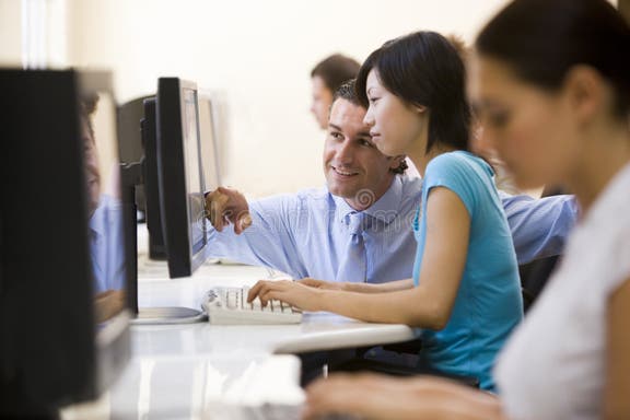 Man Assisting Woman in Computer Room Smiling Stock Image - Image of ...