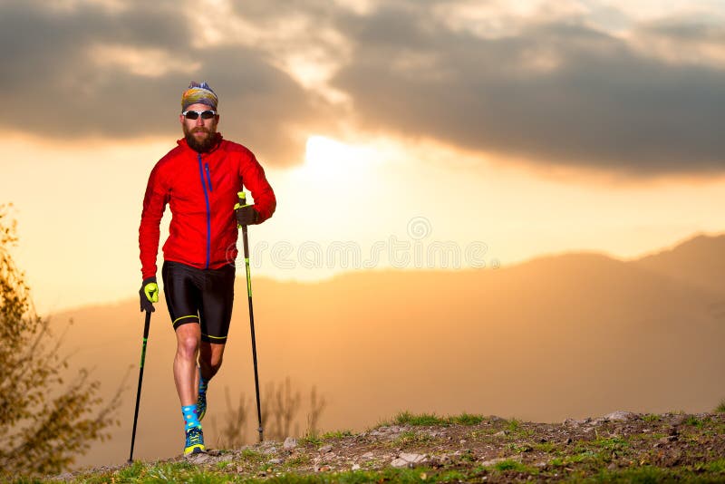 Man Athlete Practicing Trail with Sticks at Sunset Stock Image - Image ...