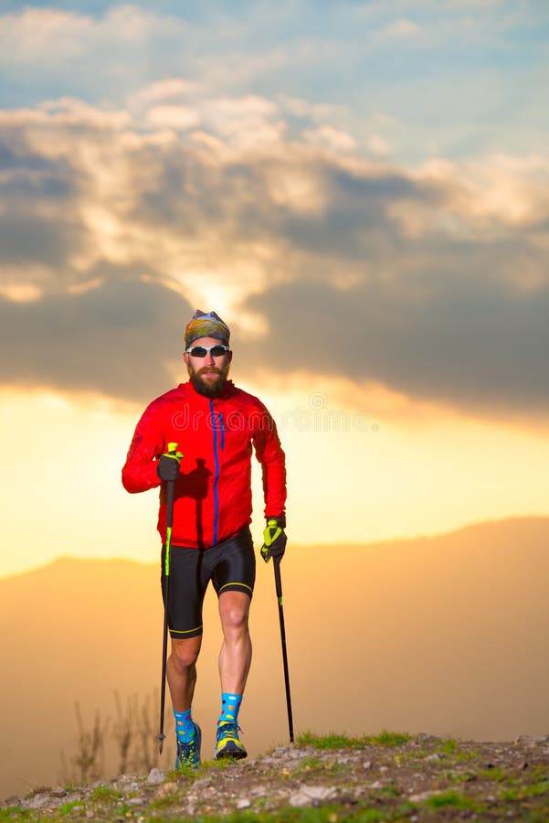 Man Athlete Practicing Trail with Sticks at Sunset Vertical Image Stock ...