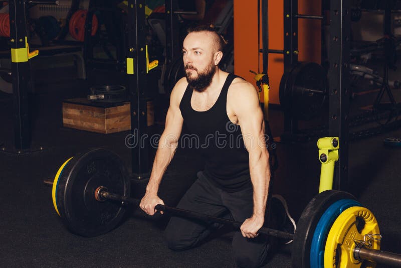 A Man of Athletic Build is Preparing To Perform an Exercise with a ...