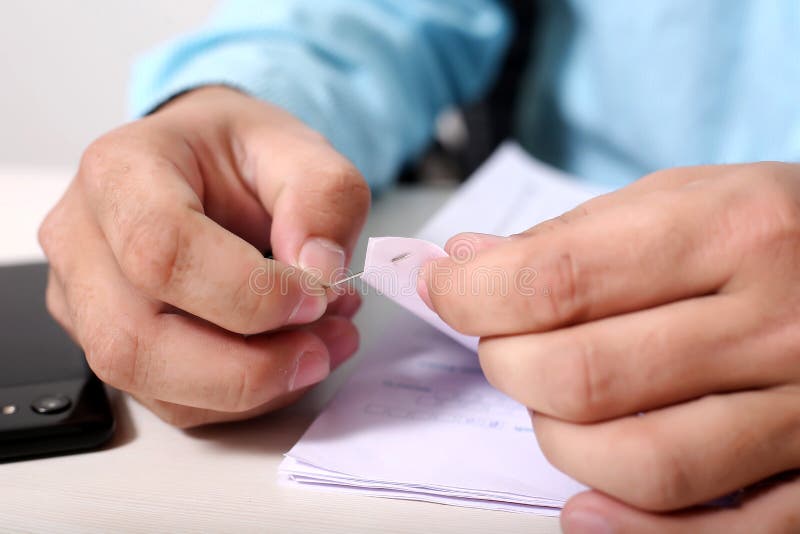Man is Attaching Multiple OMR Sheet with Paper Pin Stock Photo - Image ...