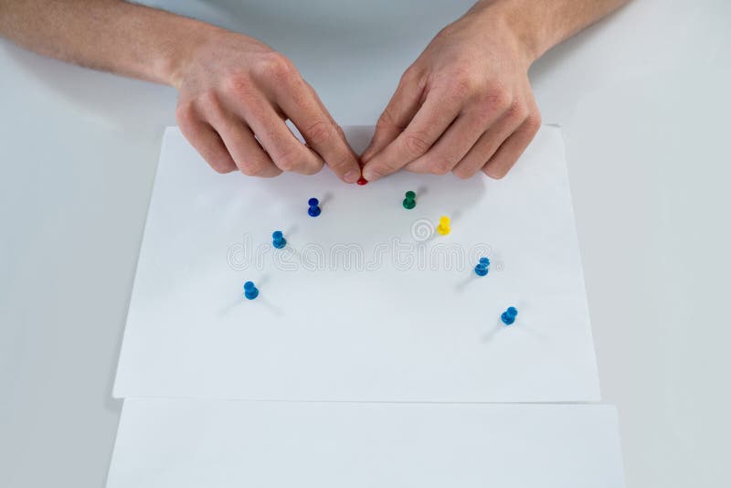 Man Attaching Push Pin Paper Stock Photos - Free & Royalty-Free Stock ...