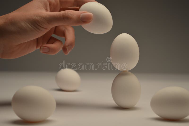 Man Balancing a Collection of Eggs Stock Image - Image of extraordinary ...