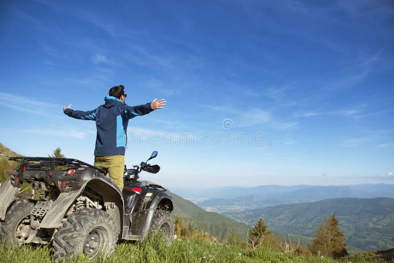 Man on the ATV Quad Bike on the Mountains Road. Stock Image - Image of ...