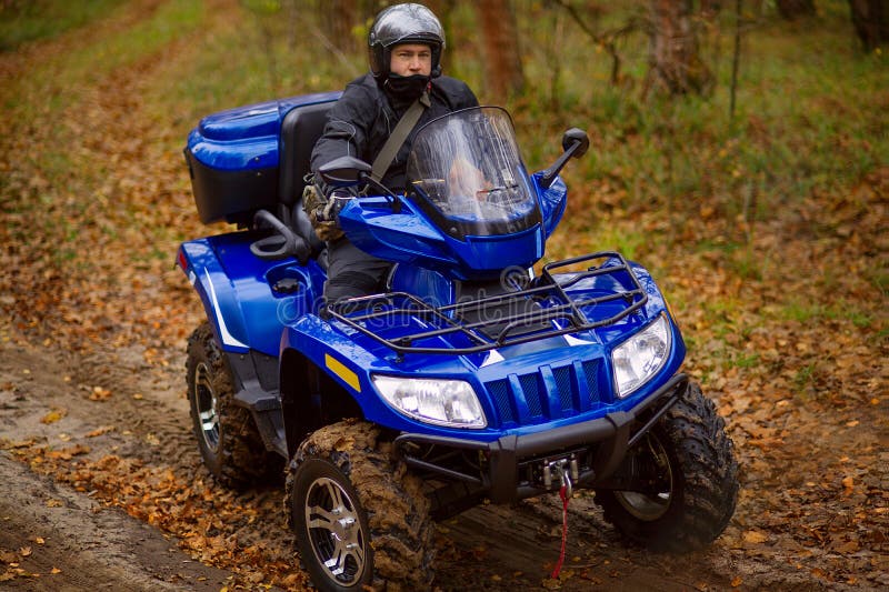 Man on ATV stock image. Image of bike, helmet, wheel - 32891935