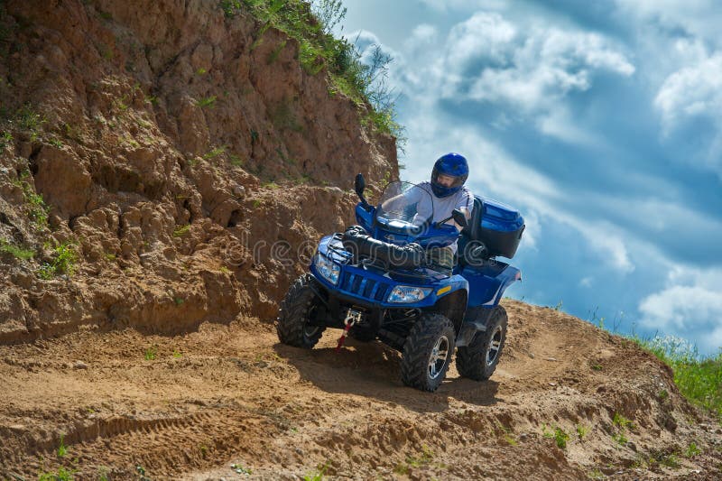 Man on ATV stock image. Image of bike, helmet, wheel - 32891935