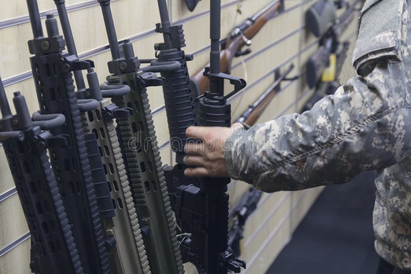 Man with an Automatic Rifle at the Counter Stock Photo - Image of guard ...