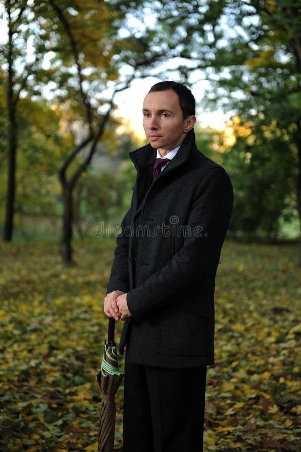 Man in autumn park stock image. Image of autumn, sidewalk - 12026083