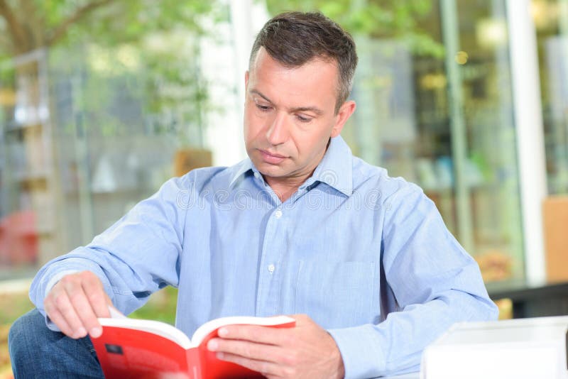 Man avid reader stock photo. Image of adult, reading - 304133084