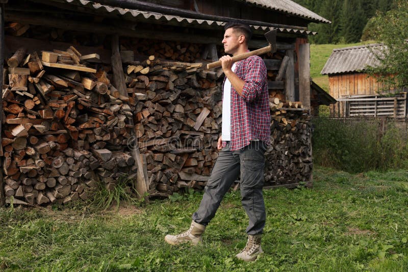 Man with Ax Near Log Pile Outdoors Stock Image - Image of nature, adult ...