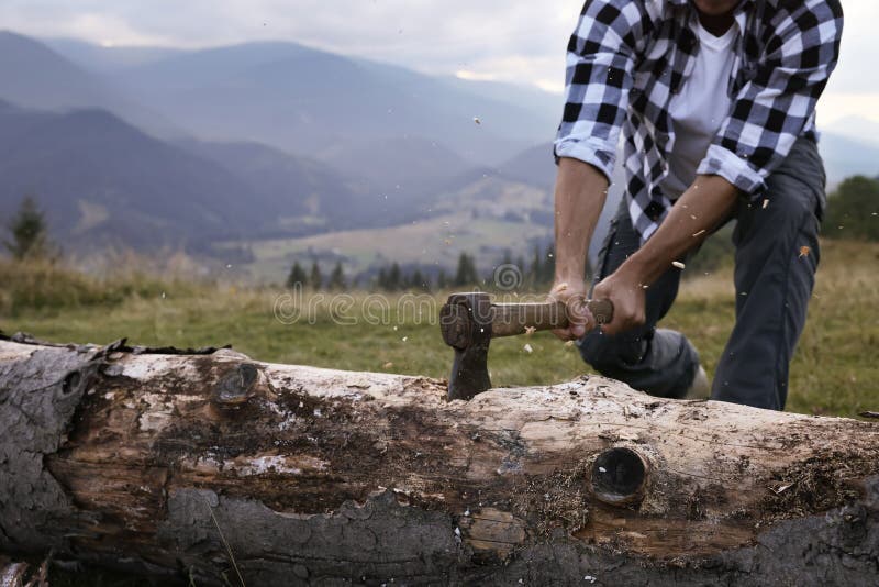 Man with Axe Cutting Tree Log in Mountains, Closeup Stock Photo - Image ...