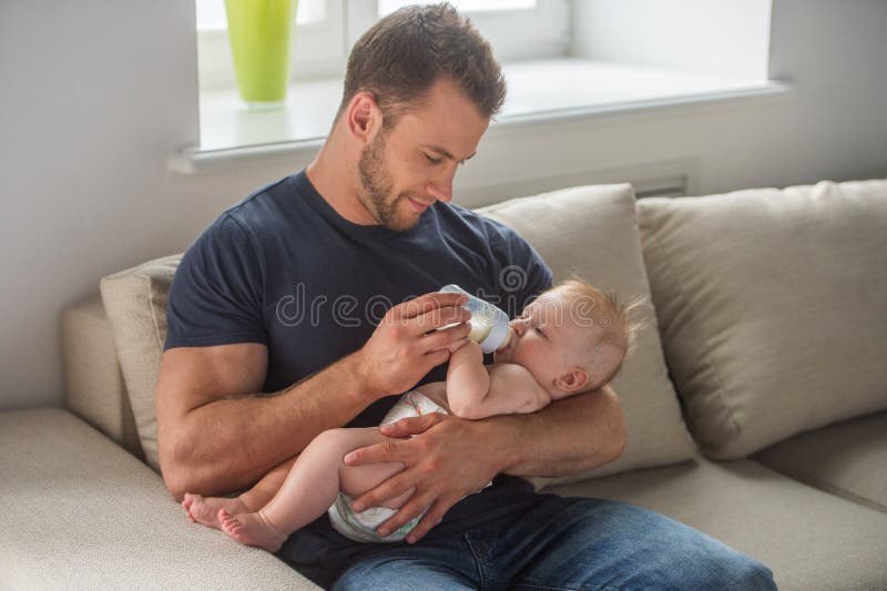 Man with baby. stock photo. Image of baby, indoors, life - 33593230