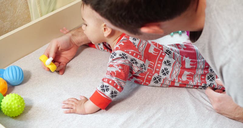 Man with Baby. Young Man Playing with Little Baby Stock Video - Video ...