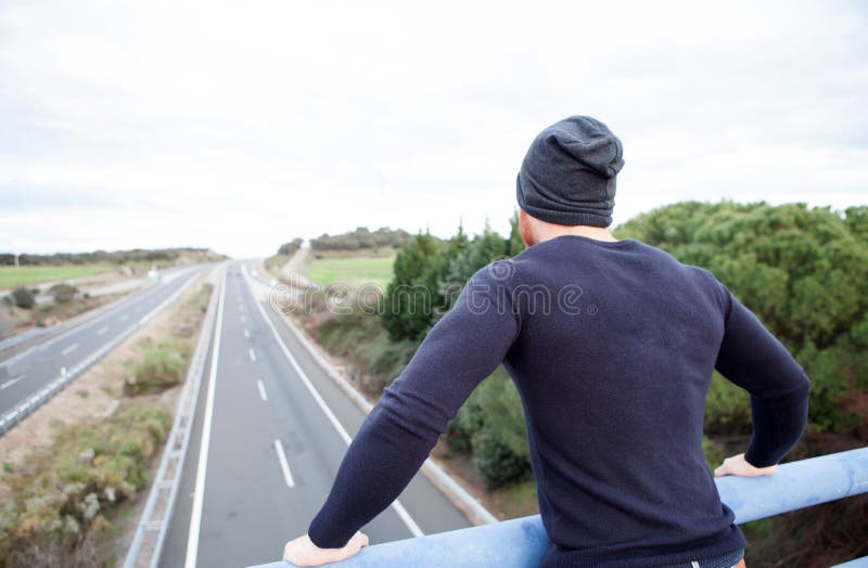 Man Back at the Top of a Bridge Over a Highway Stock Image - Image of ...