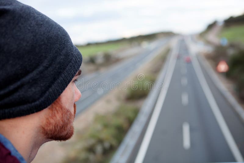 Man Back at the Top of a Bridge Over a Highway Stock Photo - Image of ...