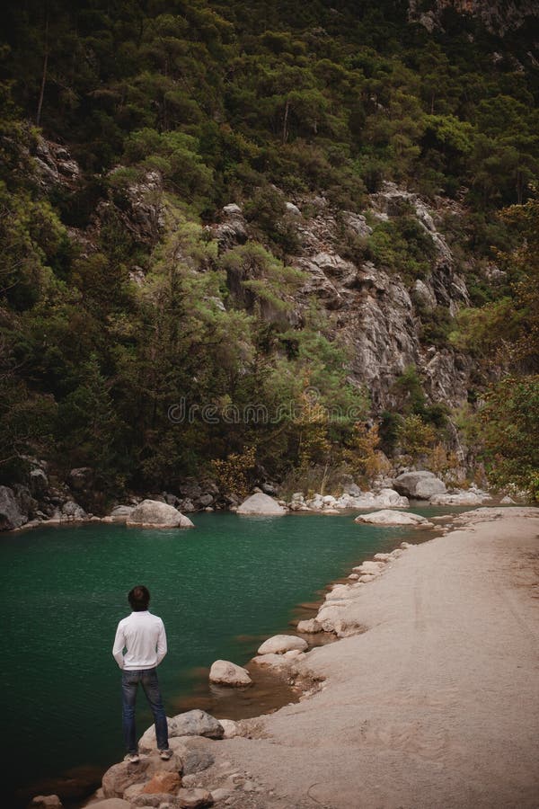 Man on the Background of a Mountain Lake, Tranquility and Unity with ...