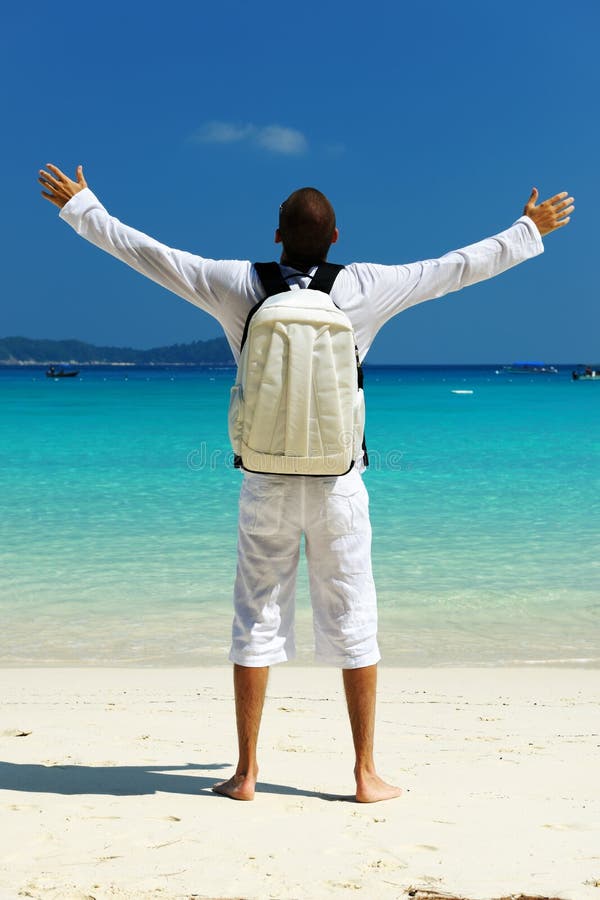Man with backpack at beach stock photo. Image of holiday - 27744992