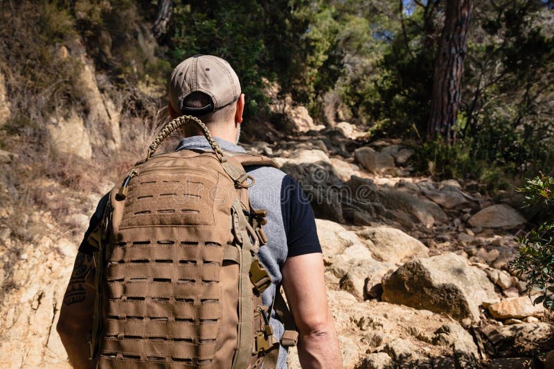 Man with Backpack Hiking in the Mountains with Sunlight Stock Image ...