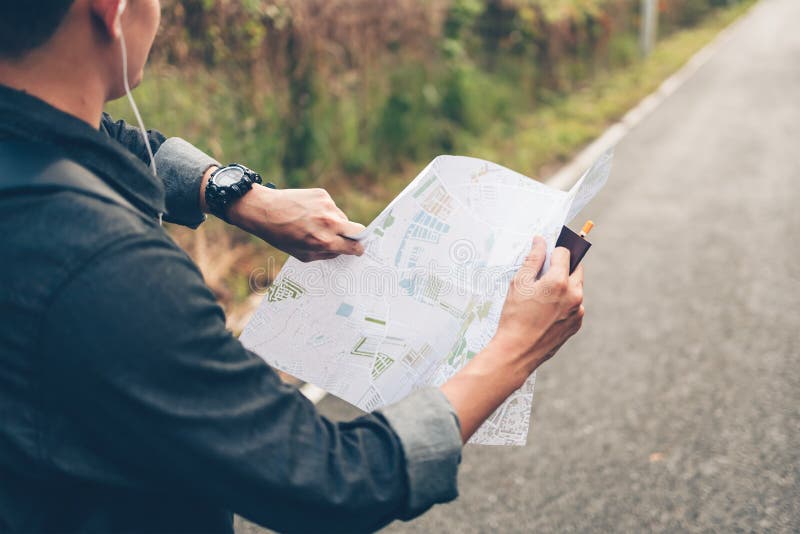 Man with Backpack Hold Map Checking Time the Bus and he and Walking on ...