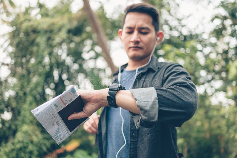 Man with Backpack Hold Map Checking Time the Bus and he and Walking on ...