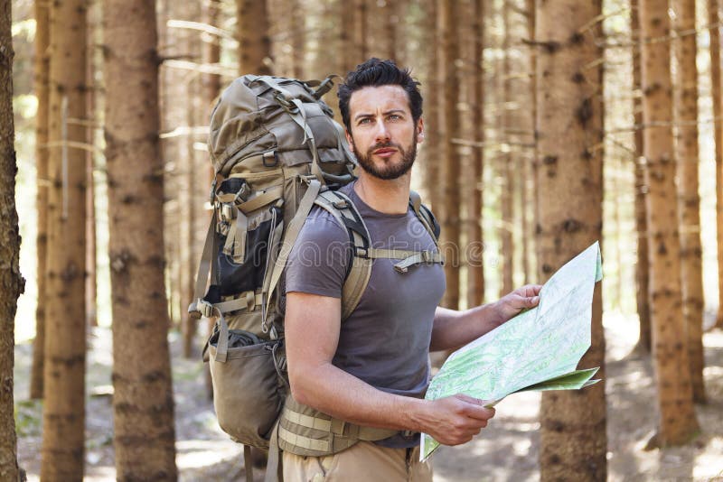 Man with Backpack and Map Searching Directions Stock Image - Image of ...