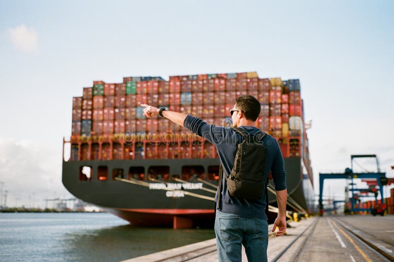 Man Points at a Large Container Ship at a Port. Ai Generated. Stock ...