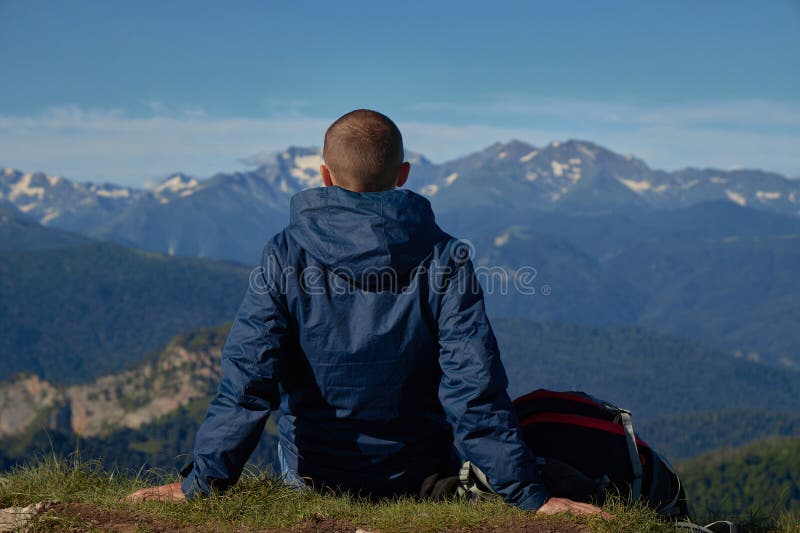 Man with Backpack on Top of a Hill with Mountains, Landscape. Man ...