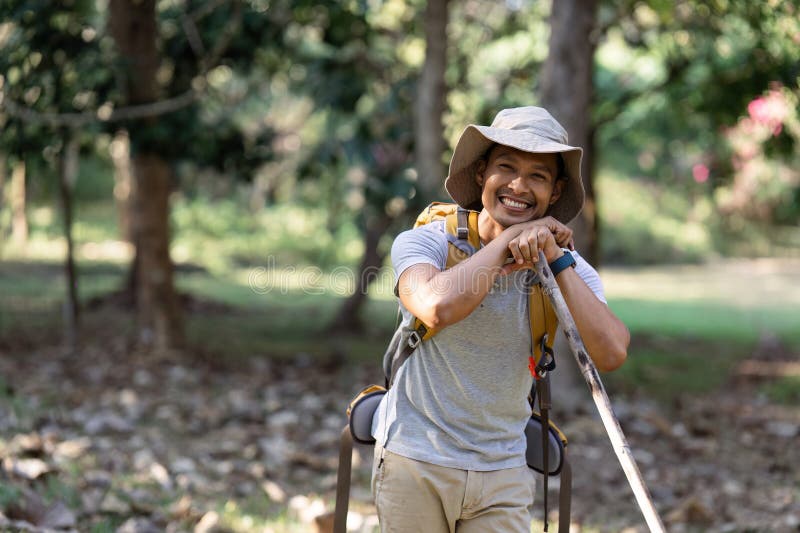 Man with Backpack Walk Along Forest Path while Hiking and Camping on ...
