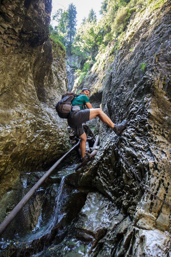 Man Backpacker Going Down in a Gorge Stock Photo - Image of hiker ...