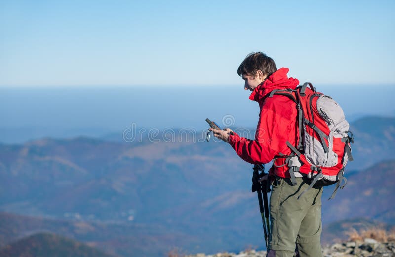 Man Backpacker on the Peak of the Mountain Stock Image - Image of ...