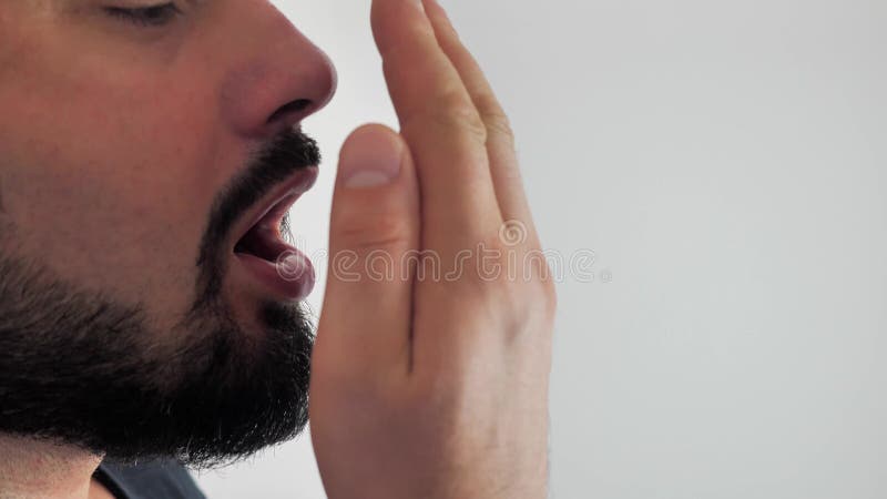 Man with Bad Breath Smelling His Breath in Hand Stock Footage - Video ...