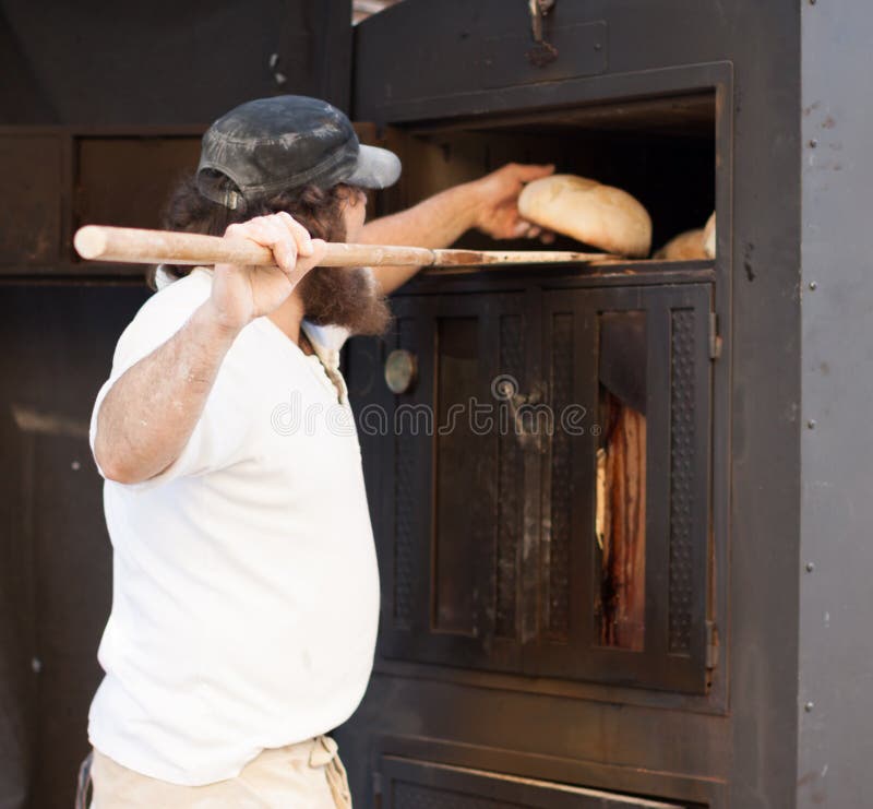 The man bakes bread stock image. Image of bread, ethnicity - 108865917