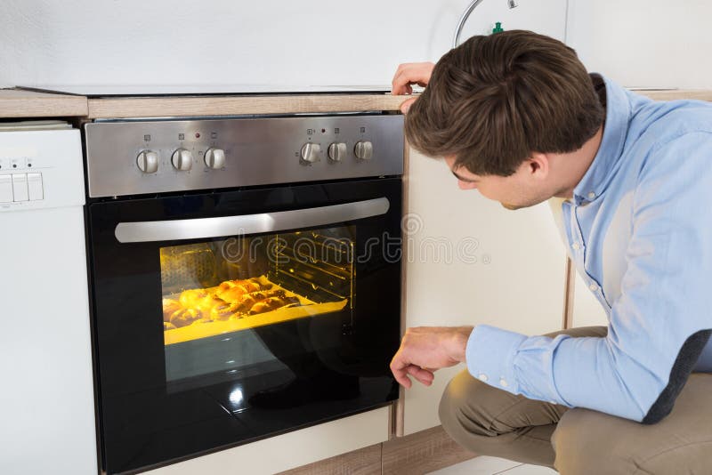 Man Baking Bread in Oven stock image. Image of diet, food - 58559765