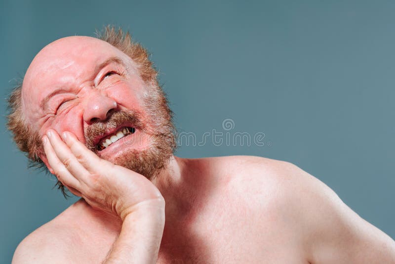 Man Expressing Discomfort while Resting His Head on His Hand Stock ...