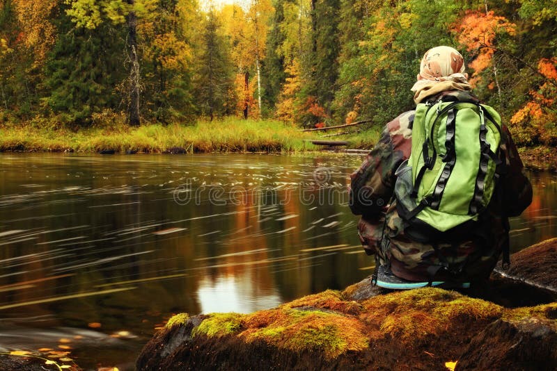 Man at bank of fall river stock photo. Image of bank - 64403360