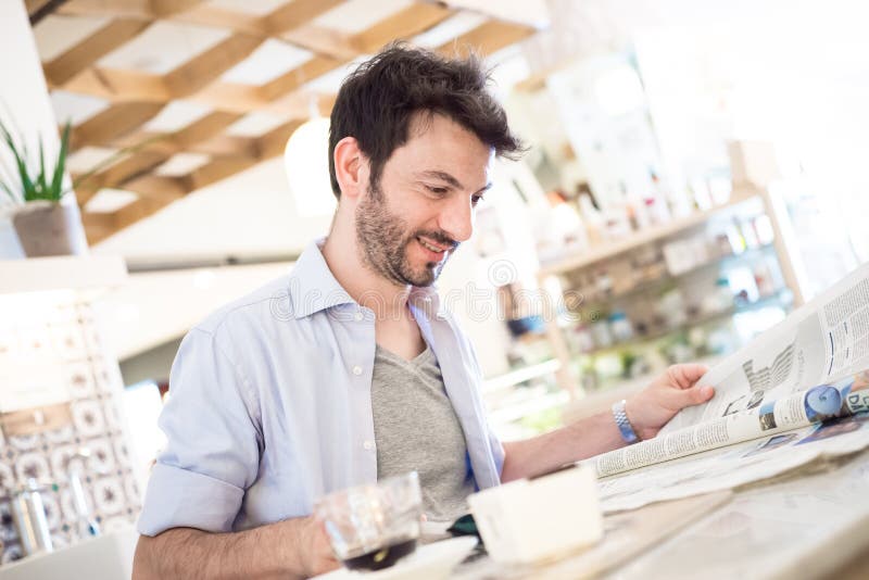 Man at the Bar Reading Newspaper Stock Photo - Image of casual, city ...