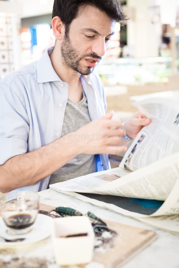 Man at the Bar Reading Newspaper Stock Photo - Image of coffee, bearded ...