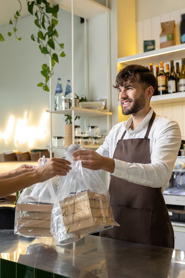 Man Bartender Handing Pizza Boxes for Unrecognizable Client in Pizzeria ...