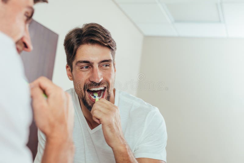 Man Brushing Teeth in the Bathroom Stock Image - Image of brushing ...