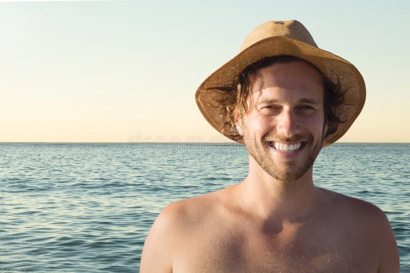 Man at the beach smiling stock photo. Image of water - 96256418