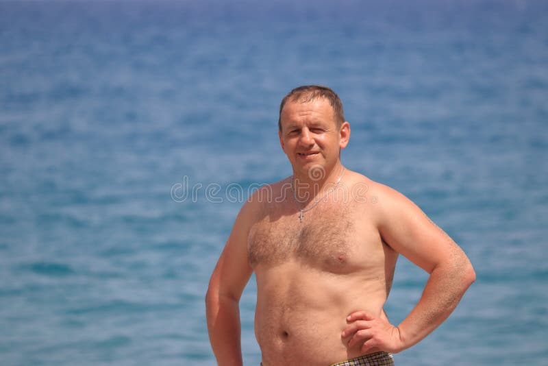 Men on the beach stock photo. Image of nature, muscular - 148115586