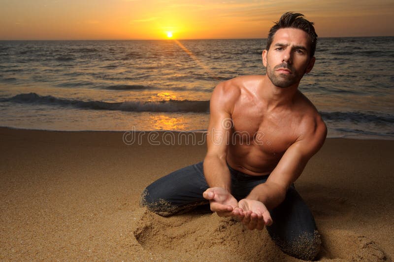 Man on the beach at sunset stock photo. Image of beach - 23492274