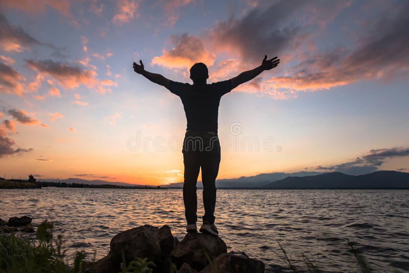 Man in the beach at sunset stock image. Image of view - 241063995