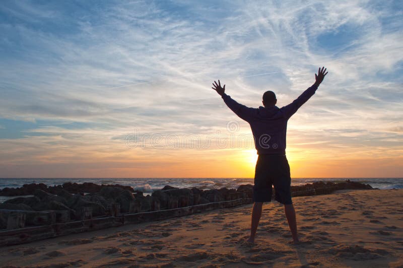 Man in the beach at sunset stock image. Image of landscape - 35989399