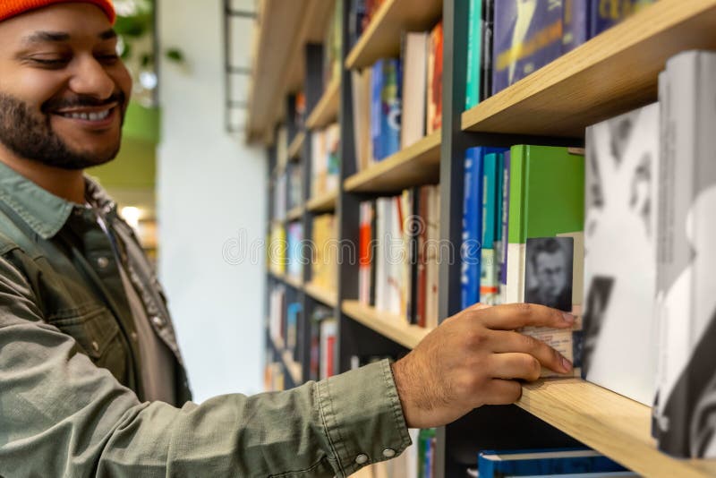 Man with Beard Browsing Books in Library Space Stock Photo - Image of ...