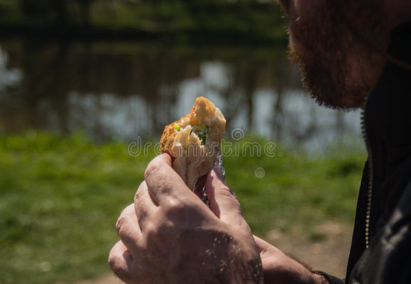 Man with Beard Eating Fast Food Outside, Closeup Stock Photo - Image of ...