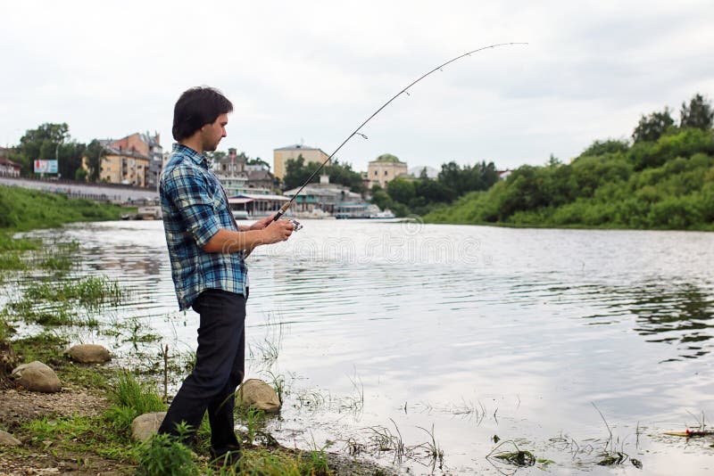 A Man with a Beard is Fishing in the River Stock Image - Image of ...