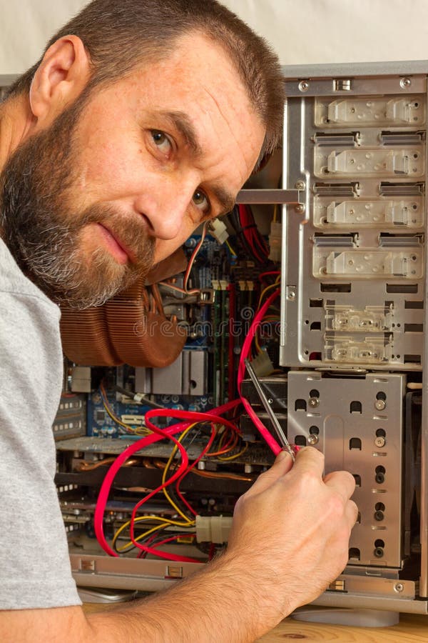A Man with a Beard Fixing the System Unit Stock Image - Image of beard ...